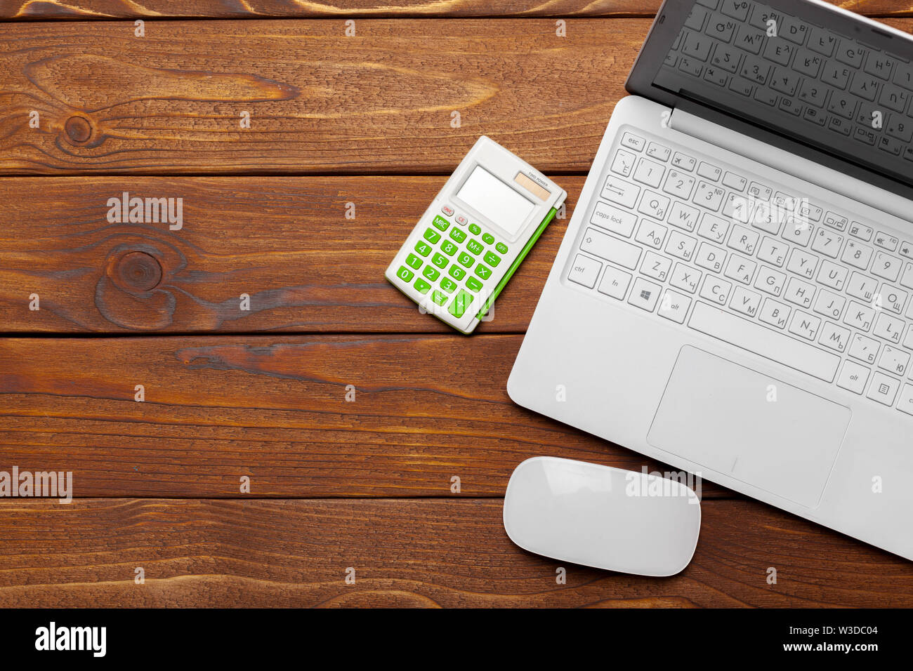 Laptop, notebook on work wooden desk Stock Photo - Alamy