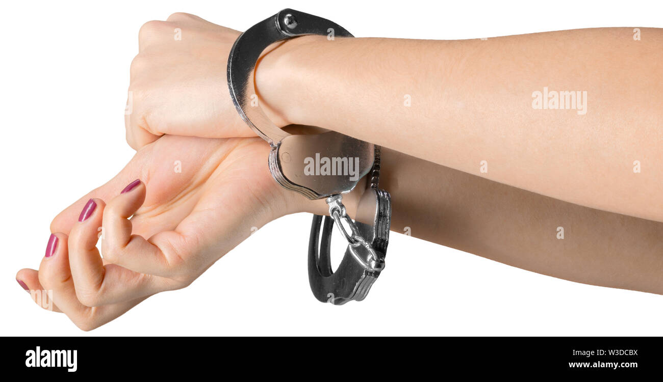 hand wearing handcuffs isolated on white background Stock Photo - Alamy