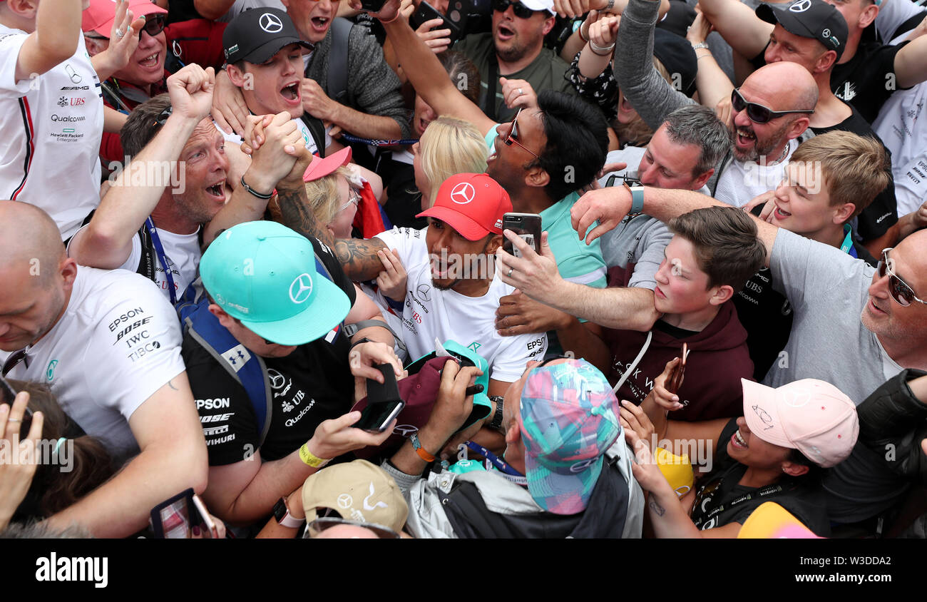Lewis Hamilton celebrates with his fans after the British Grand Prix at ...