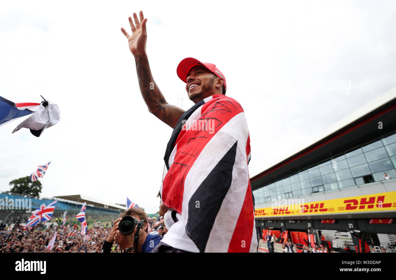 Lewis Hamilton celebrates with his fans after victory in the British ...