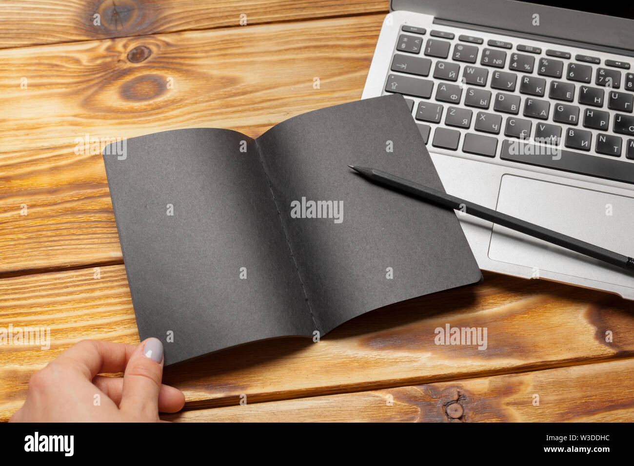 Laptop, notebook on work wooden desk Stock Photo - Alamy