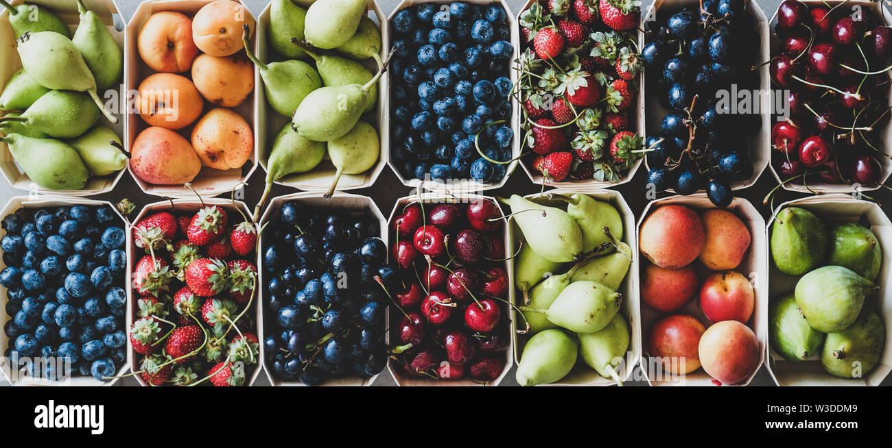 Summer fruit and berry assortment in wooden boxes, top view Stock Photo ...