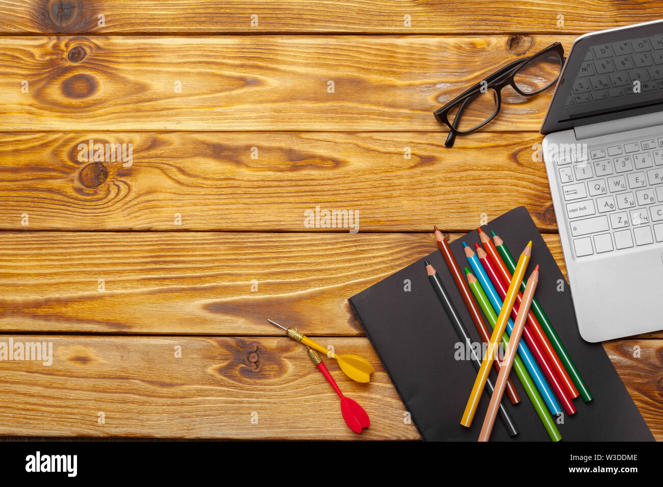 Laptop, notebook on work wooden desk Stock Photo - Alamy