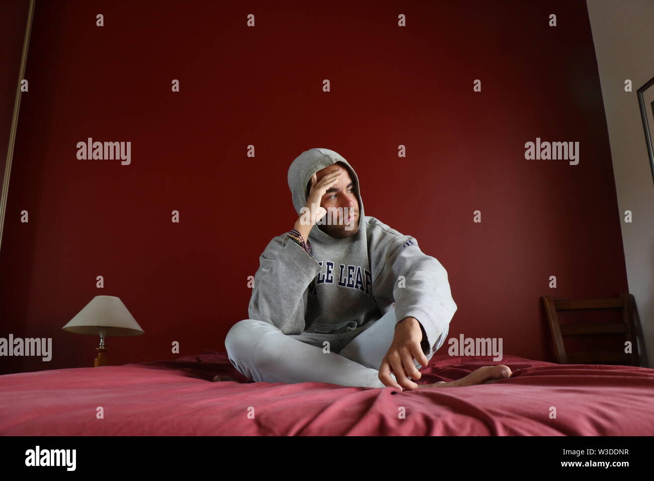 Young adult male and mental health generic Stock Photo - Alamy