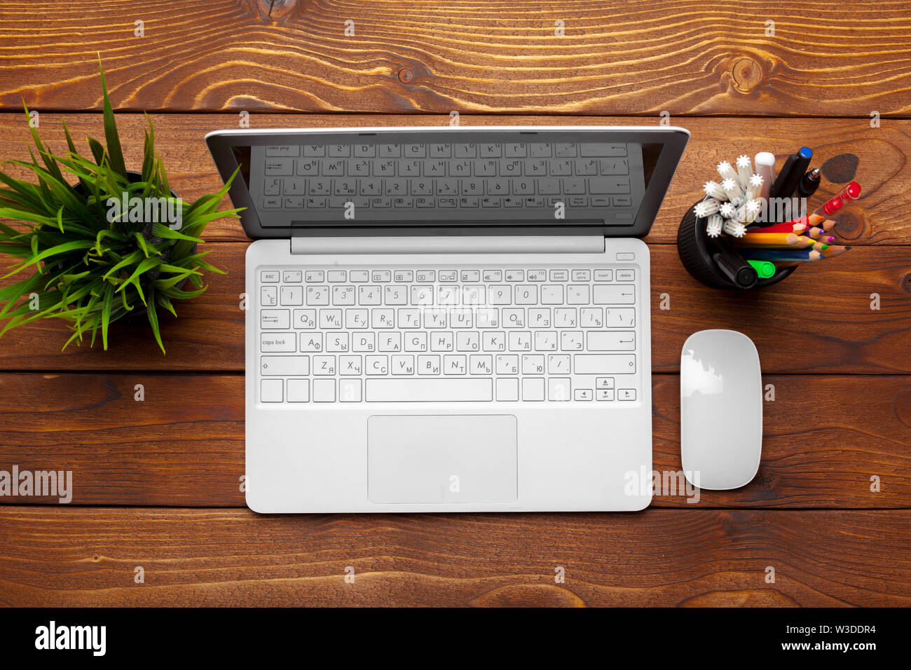 Laptop, notebook on work wooden desk Stock Photo - Alamy