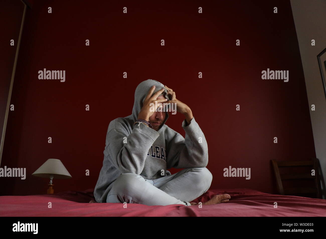 Young adult male and mental health generic Stock Photo - Alamy