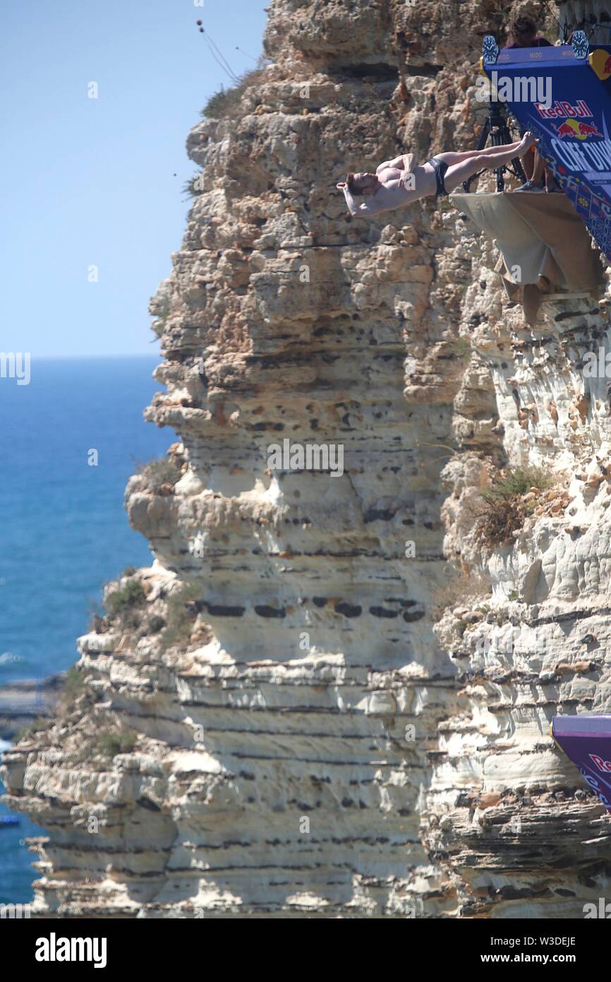 Beirut, Lebanon. 14th July, 2019. A cliff diver jumps from the landmark ...