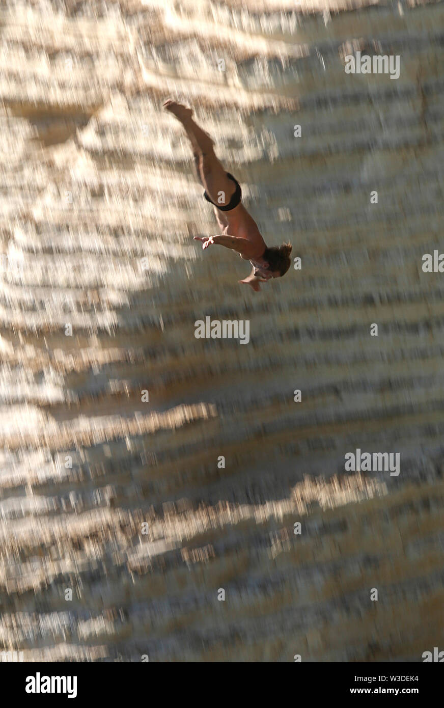 Beirut, Lebanon. 14th July, 2019. A cliff diver jumps from the landmark ...