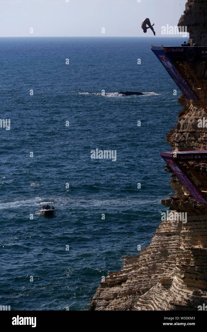 Beirut, Lebanon. 14th July, 2019. A cliff diver jumps from the landmark ...