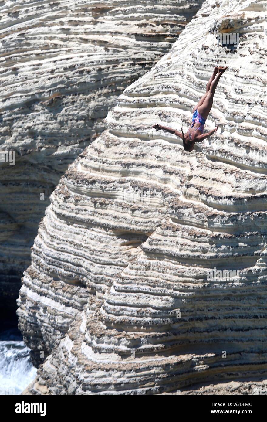Beirut, Lebanon. 14th July, 2019. A cliff diver jumps from the landmark ...