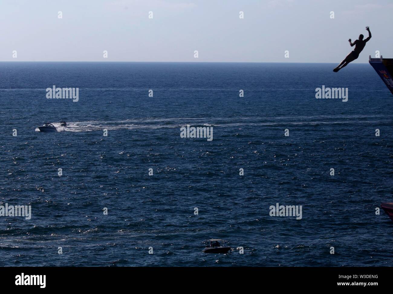 Beirut, Lebanon. 14th July, 2019. A cliff diver jumps from the landmark ...