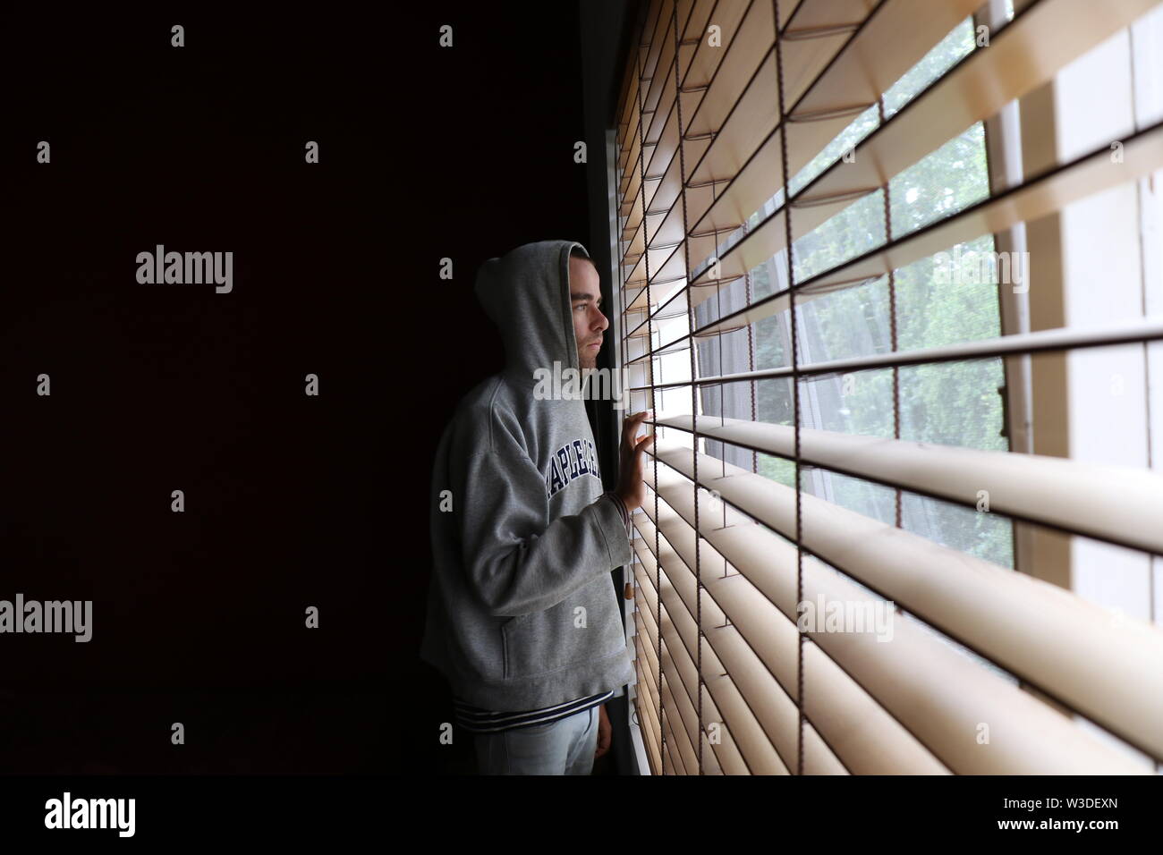 Young adult male and mental health generic Stock Photo - Alamy