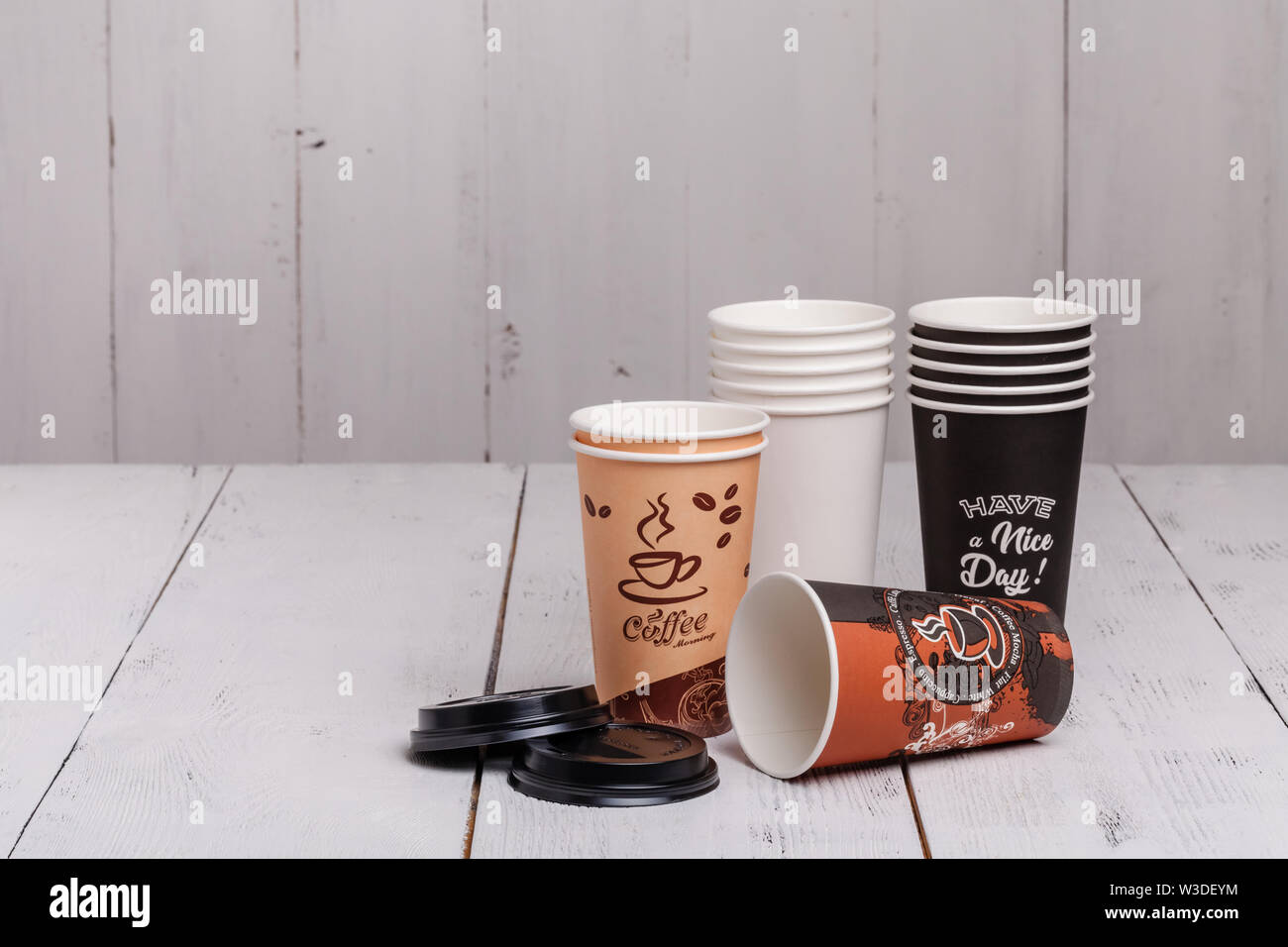 Paper cups of coffee on wooden texture background Stock Photo - Alamy