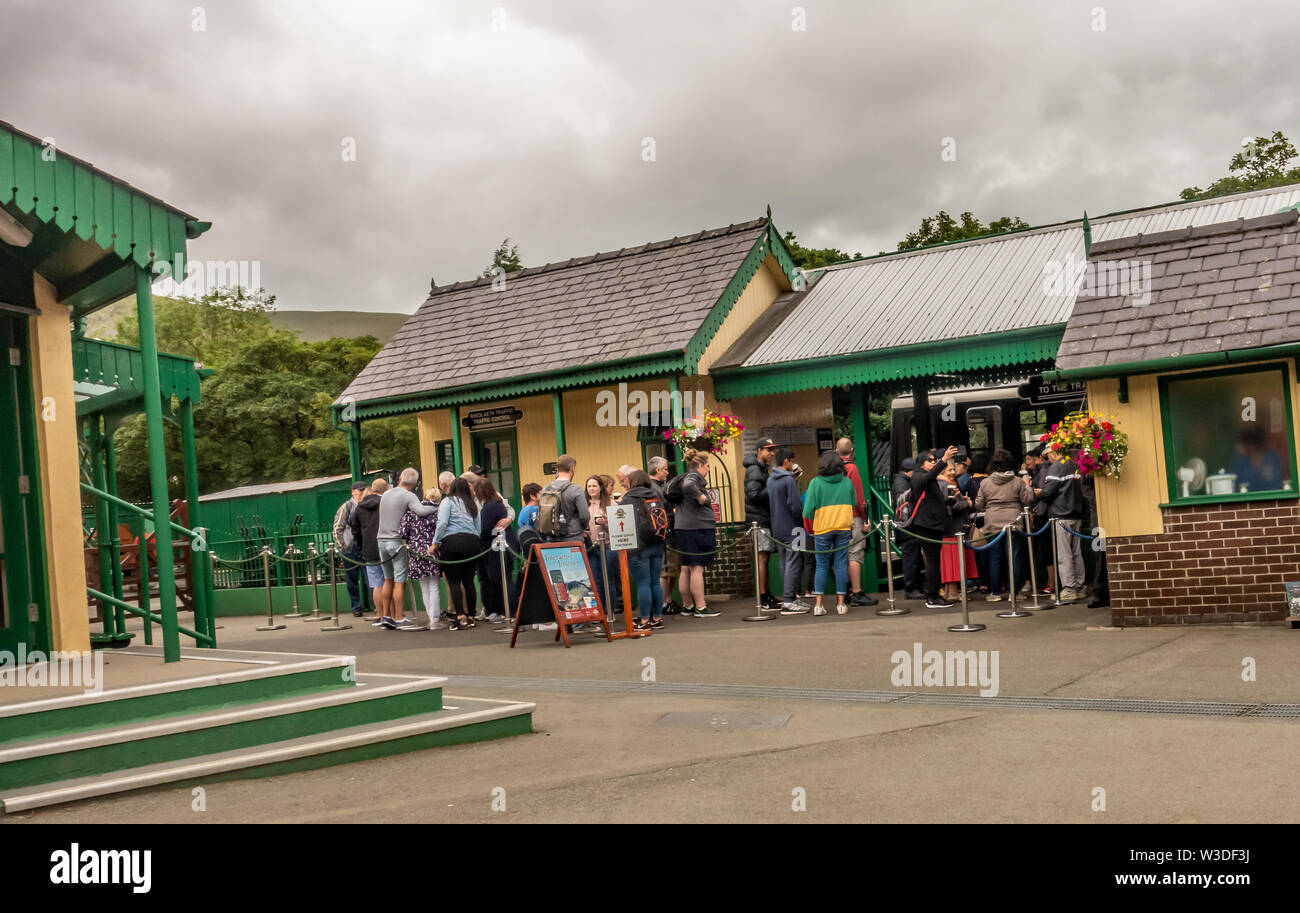 A queue of rail passengers waiting to board a train on the Mount ...