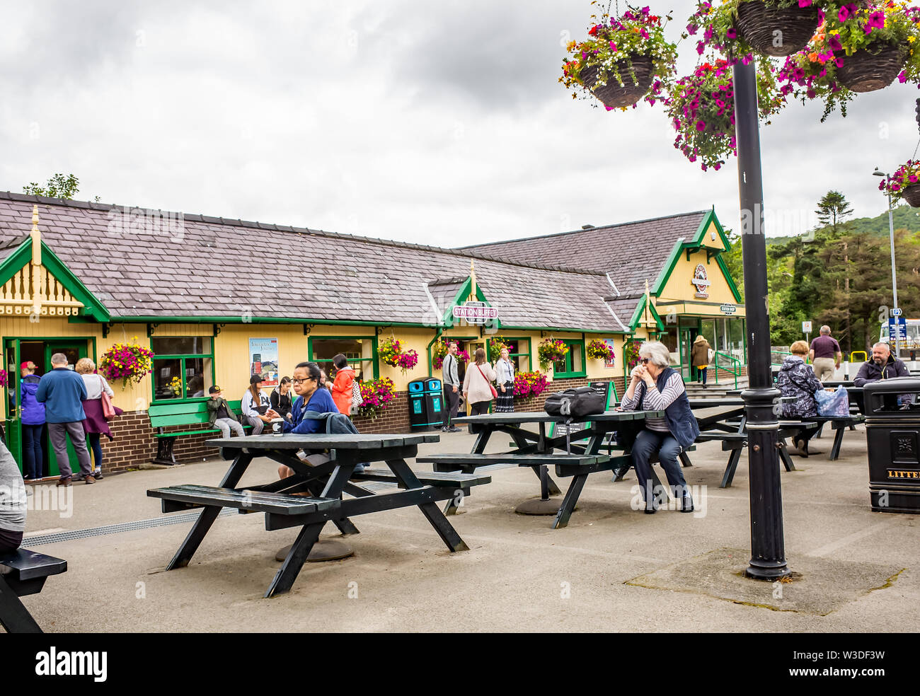 Tourists waiting outside Llanberis train station to board a train on ...