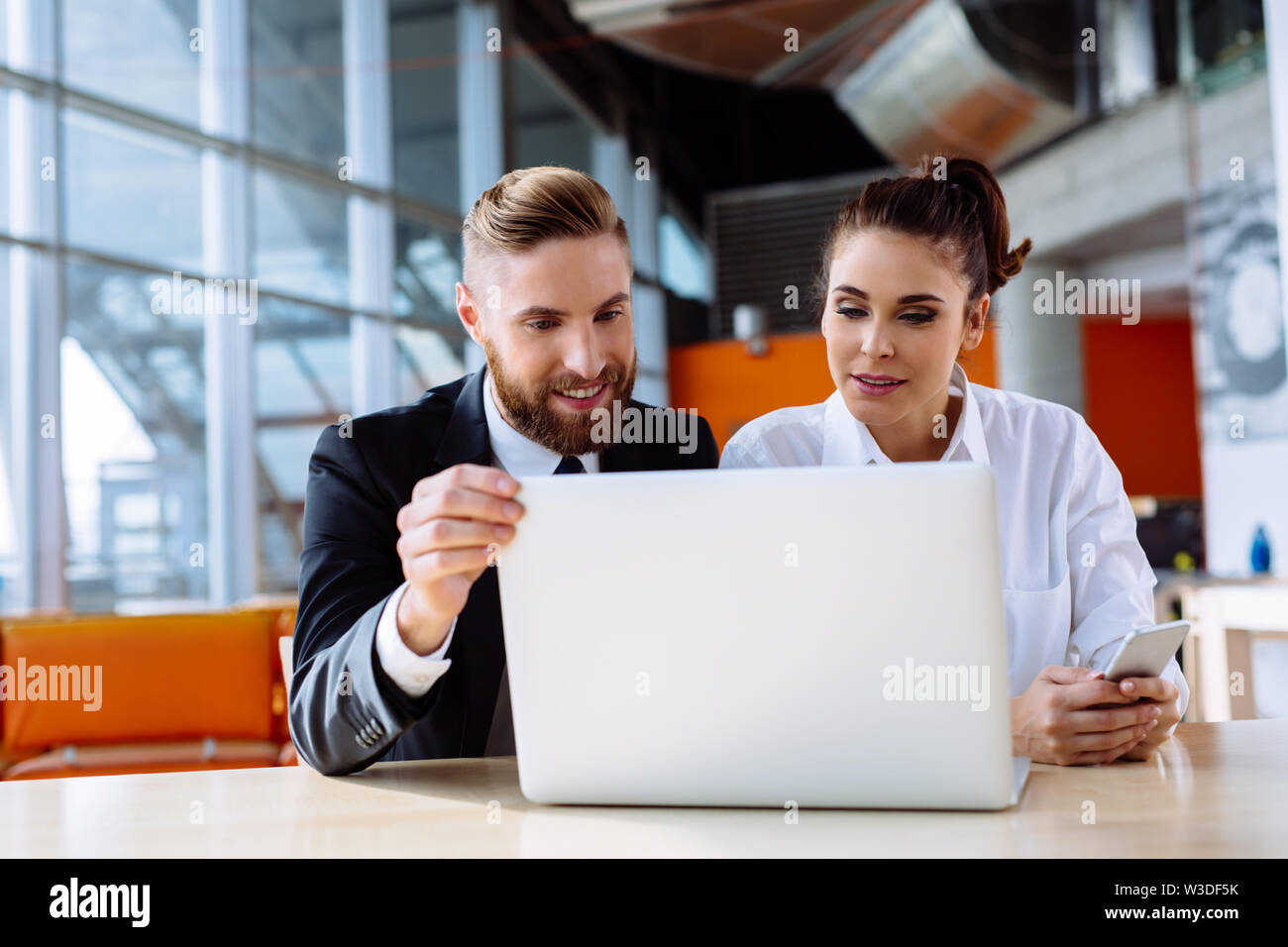 Two business partners discussing new project Stock Photo - Alamy