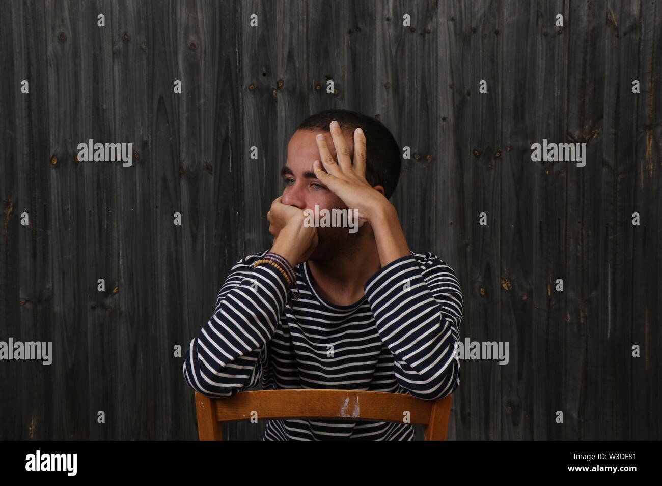 Young adult male and mental health generic Stock Photo - Alamy