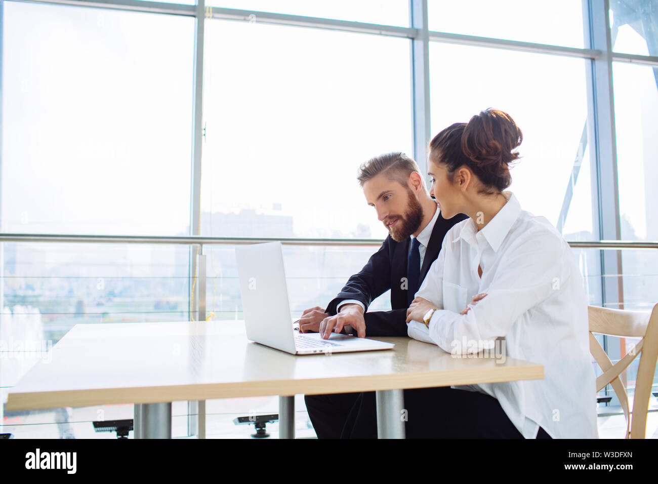 Two professionals talking office hi-res stock photography and images ...