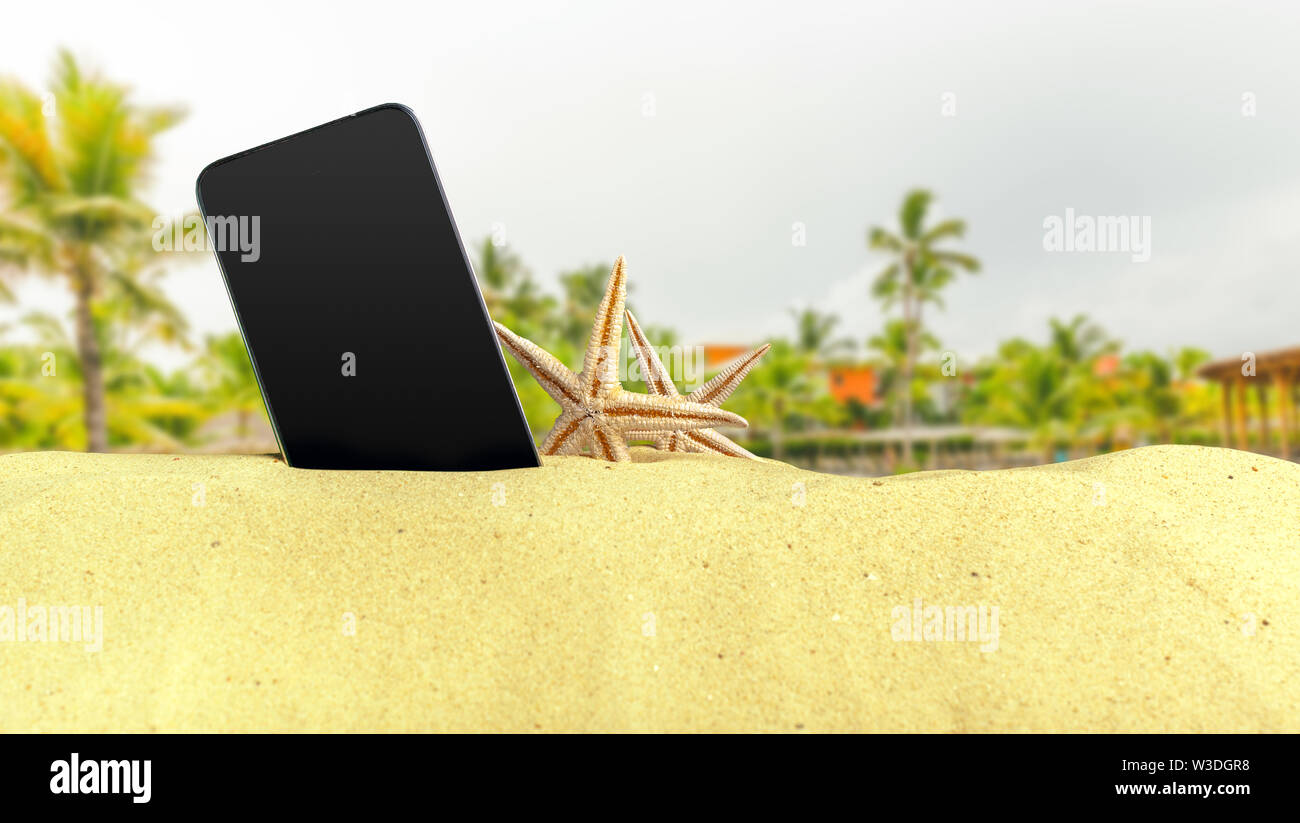 Phone on the sand Stock Photo - Alamy
