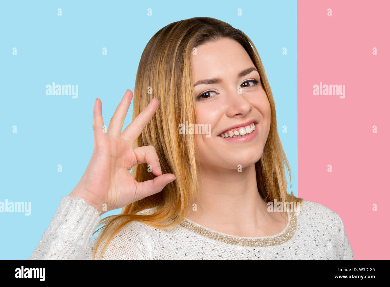 Lovely woman showing ok sign Stock Photo - Alamy