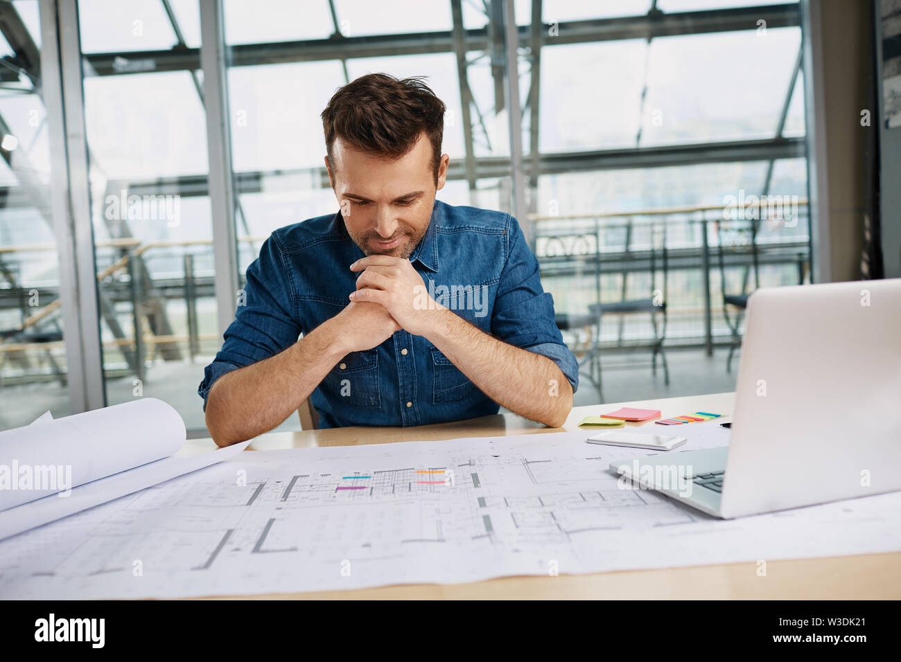Happy architect working at office Stock Photo - Alamy
