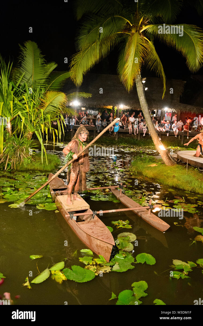 Polynesian performer punting a boat at the popular touristic show of Te ...