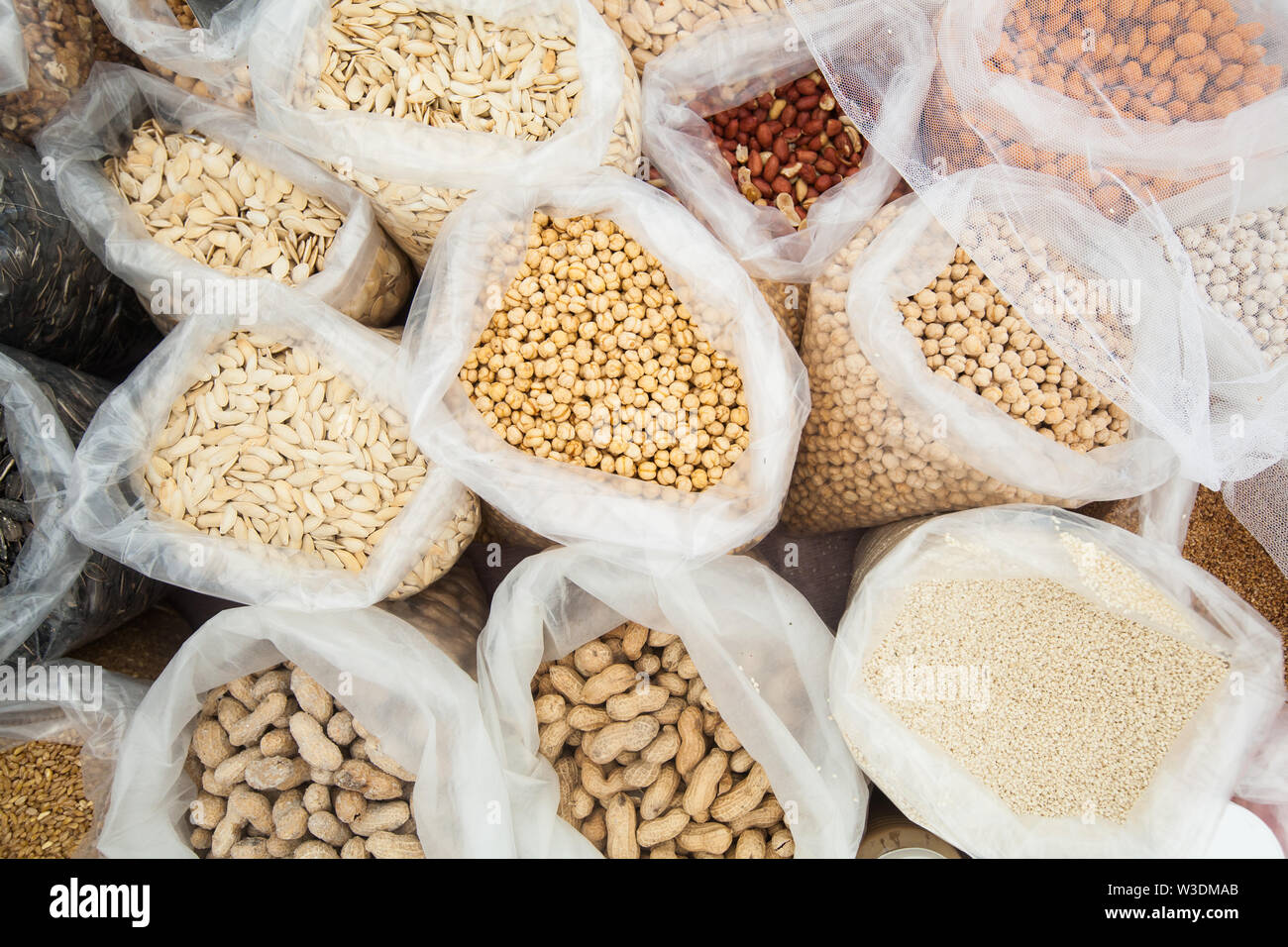 Assortment of nuts and seeds on local street market ready for sale. Top ...