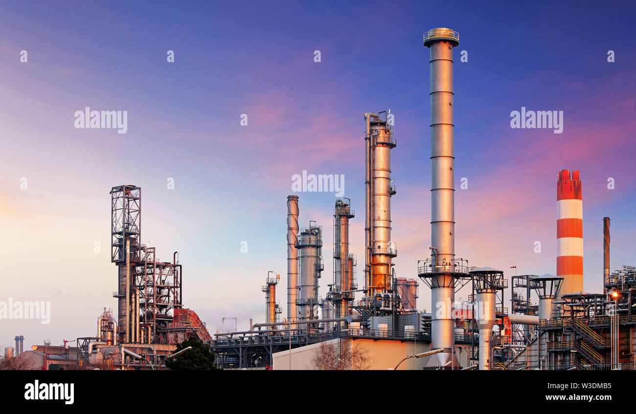 Oil refinery at sunset Stock Photo - Alamy