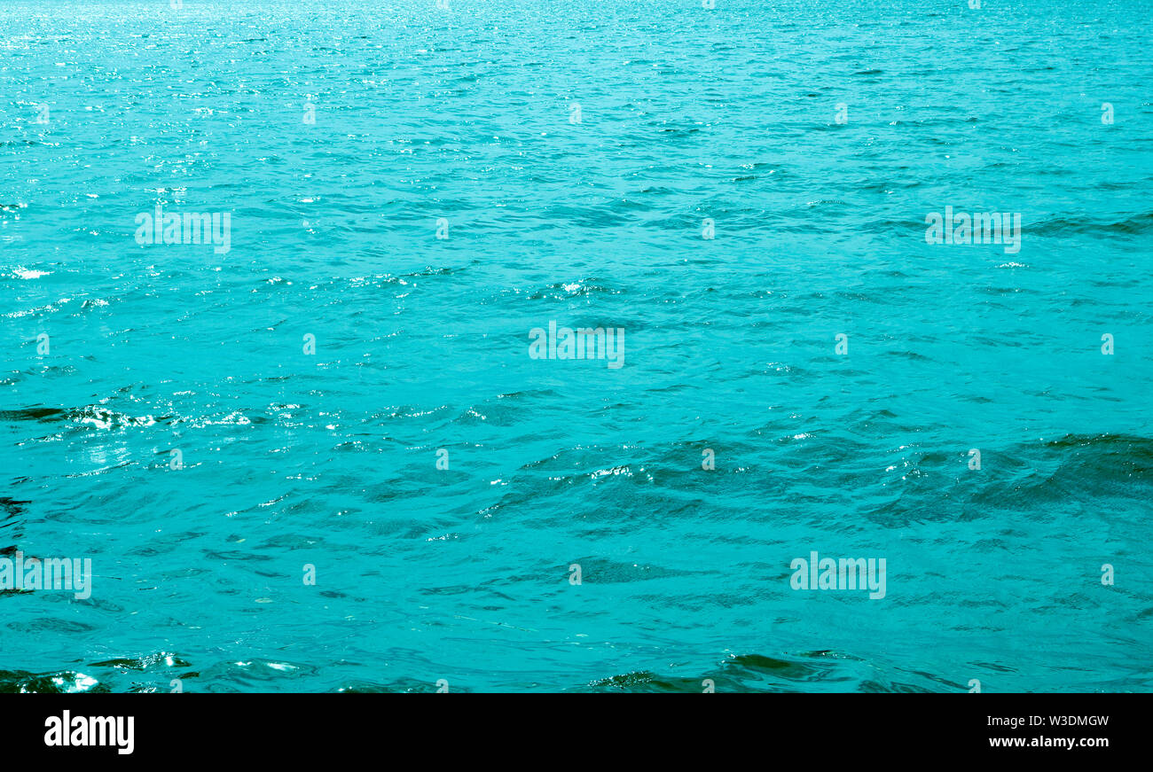 Blue azure water in the sea. Waves on the surface of the water ...