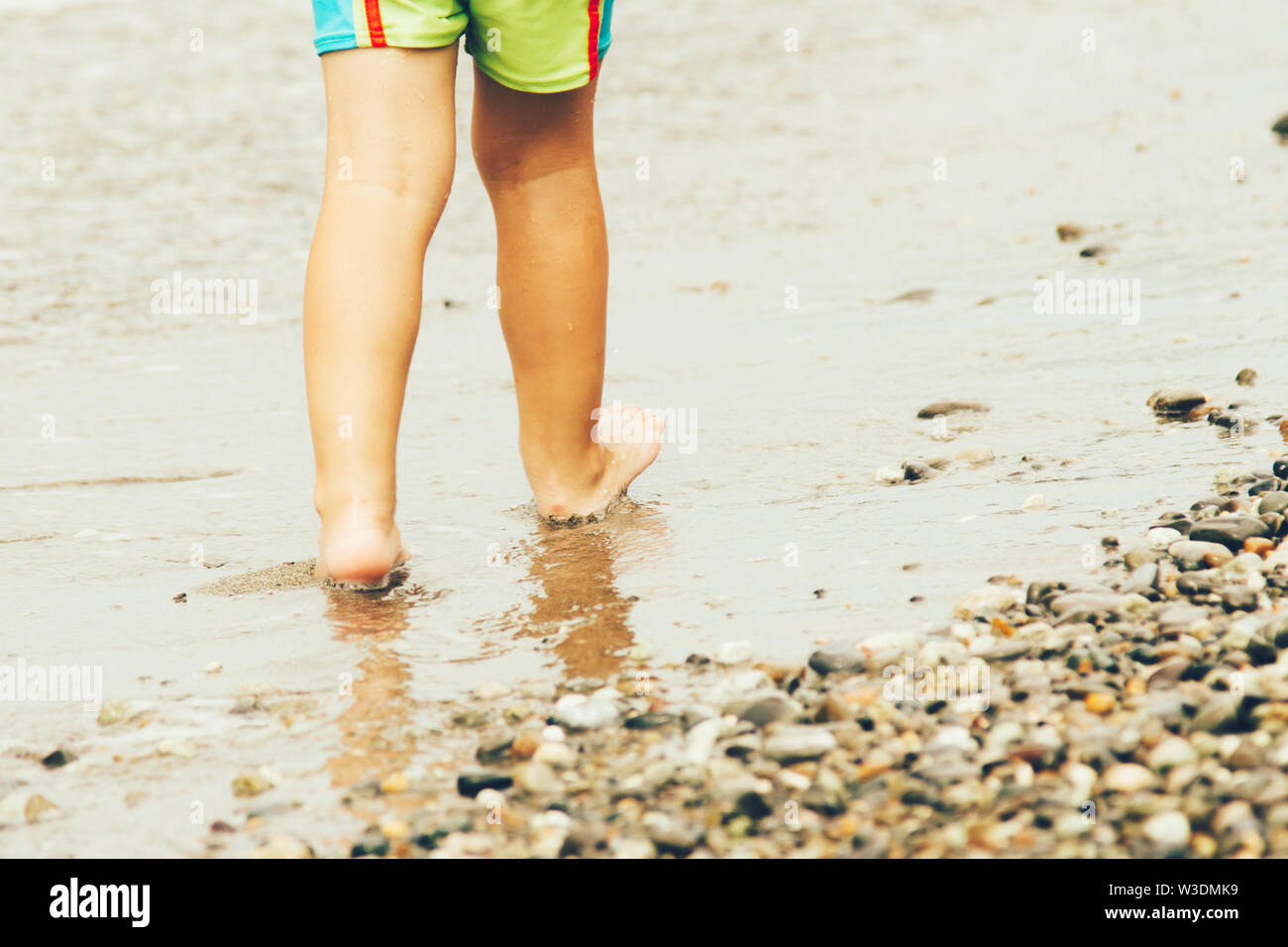 Foot barefoot baby leg sandy hi-res stock photography and images - Alamy