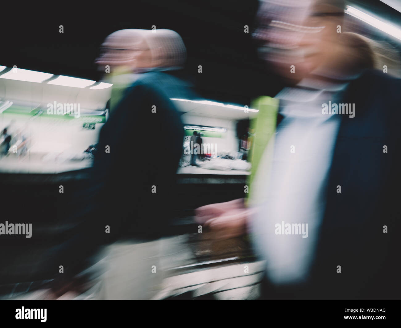 Defocused blur people silhouettes walking inside Barcelona Metro ...