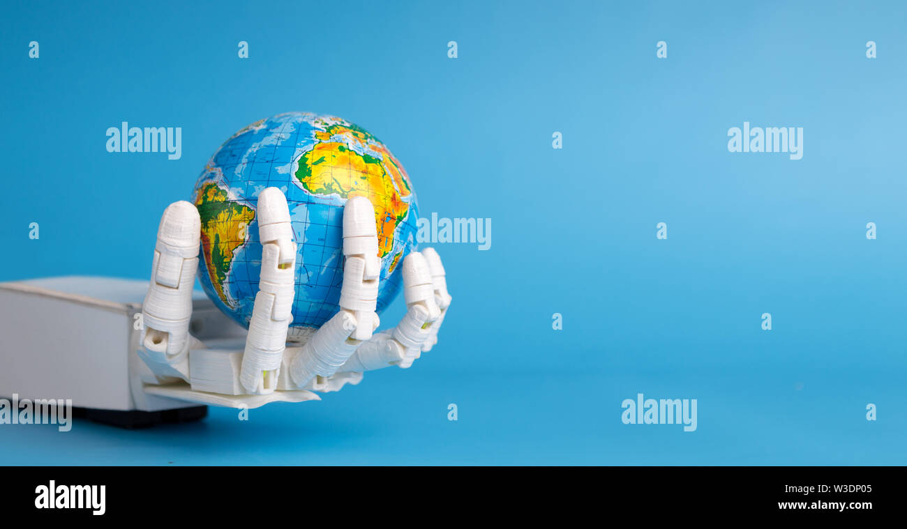 Global robotization. Robot hand holding Earth planet Stock Photo - Alamy