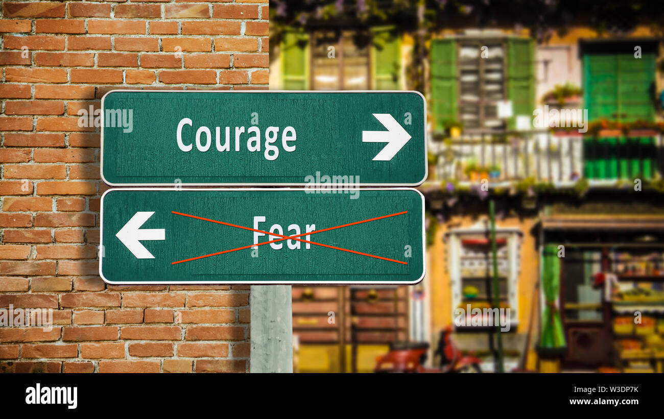 Street Sign the Direction Way to Courage versus Fear Stock Photo - Alamy