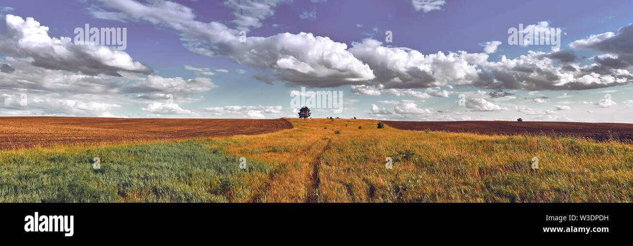 Central Russia agricultural countryside with hills and country road ...