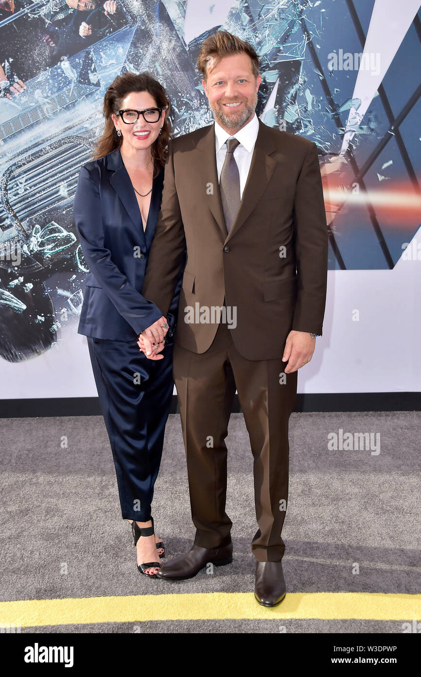Kelly McCormick with husband David Leitch at the premiere of the movie ...
