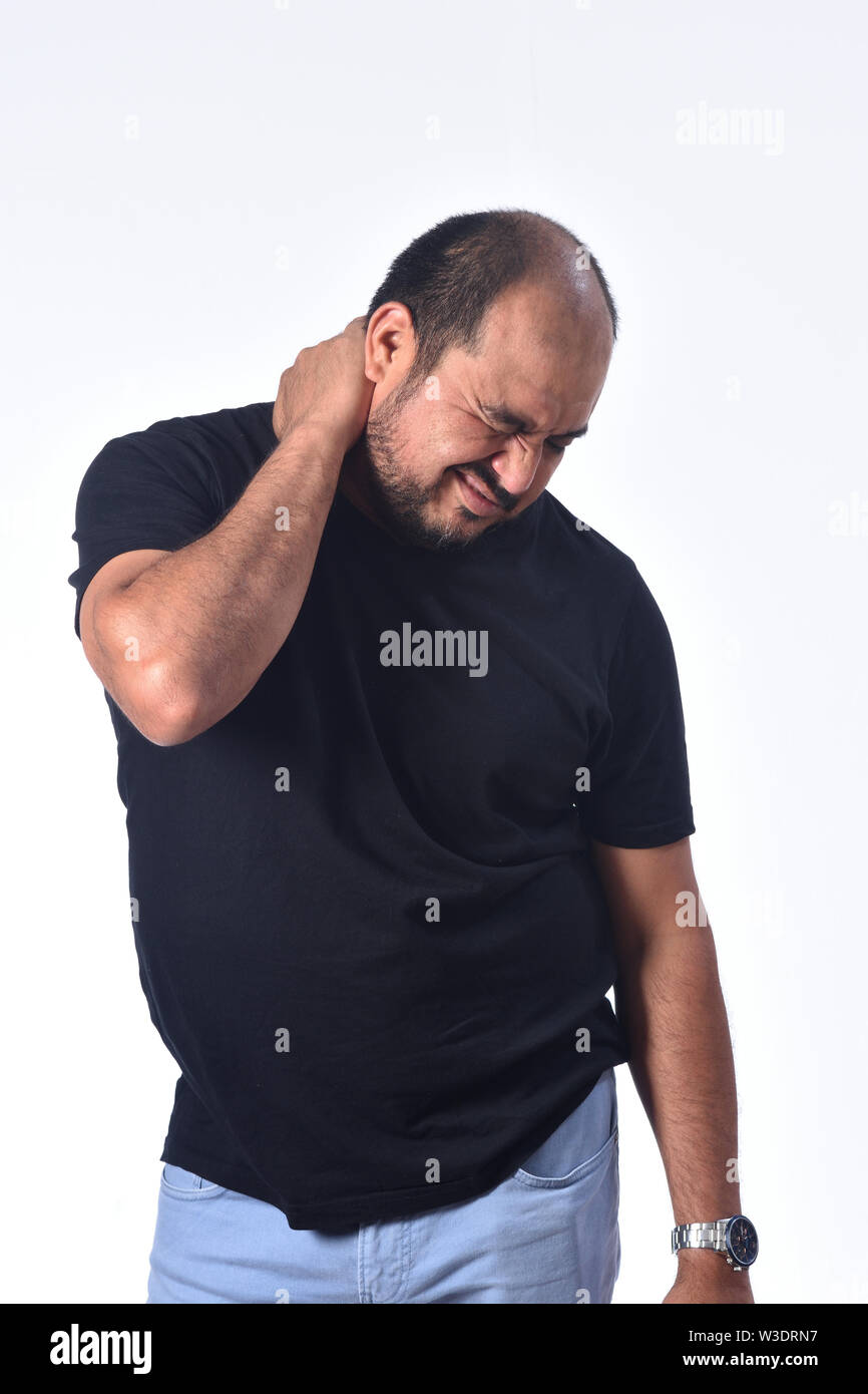latin american man with pain on nape on white background Stock Photo ...