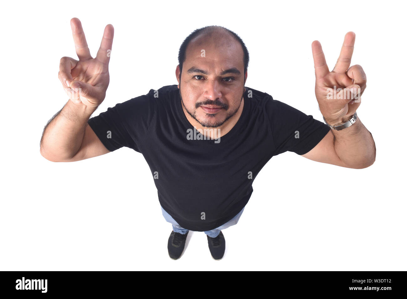 Latin american man making the victory sign on a white background Stock ...