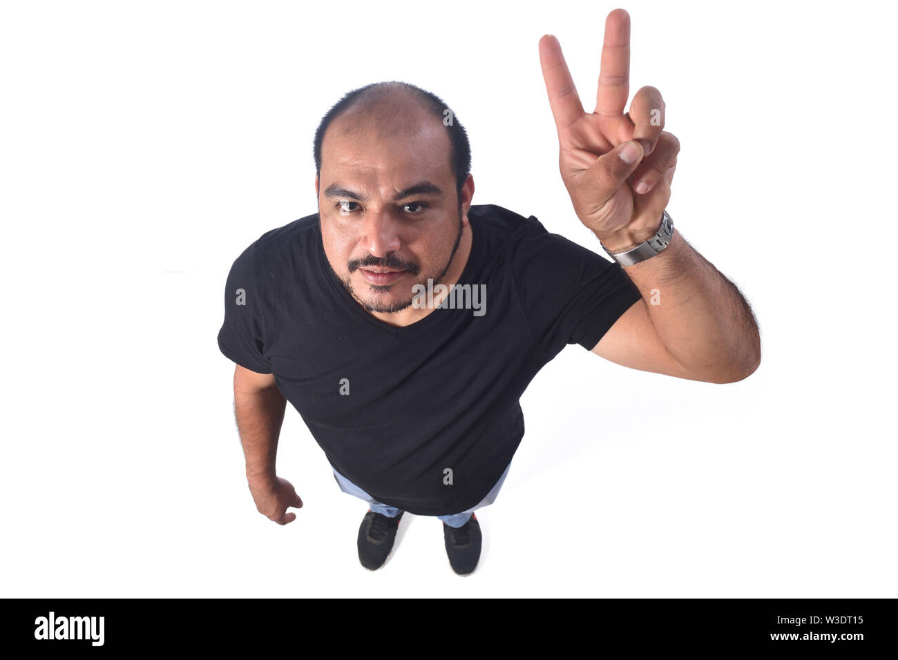 latin american man making the victory sign on a white background Stock ...