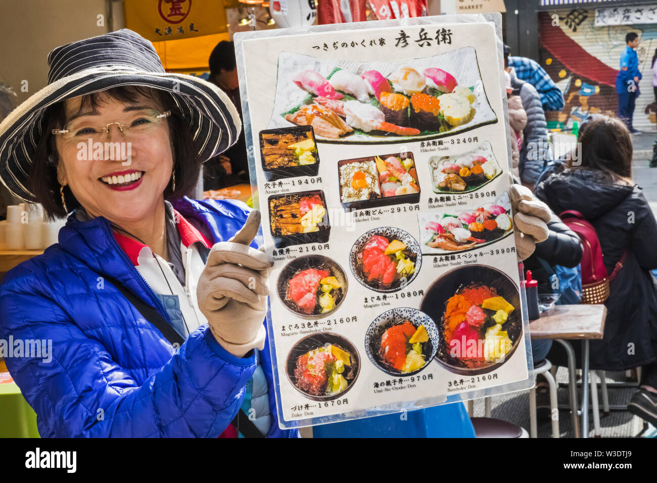 Japan, Honshu, Tokyo, Tsukiji Market, Fish Restaurant Waitress Holding ...