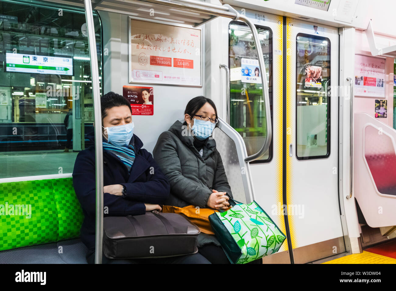 Japan, Honshu, Tokyo, Japan Railways (JR), Two Sleeping Passengers ...