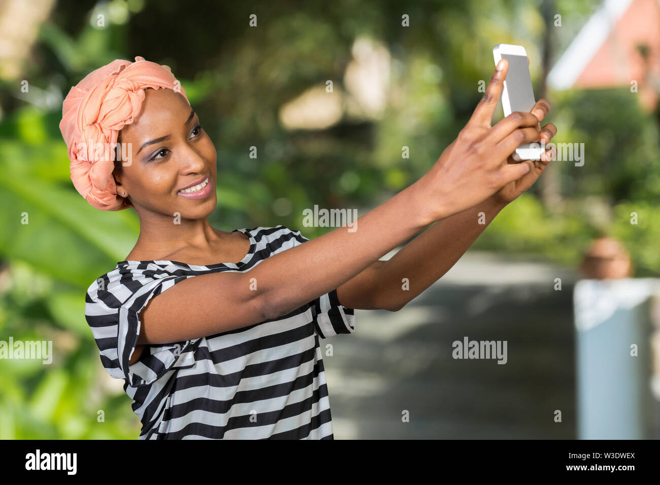 African American Woman with a mobile phone Stock Photo - Alamy