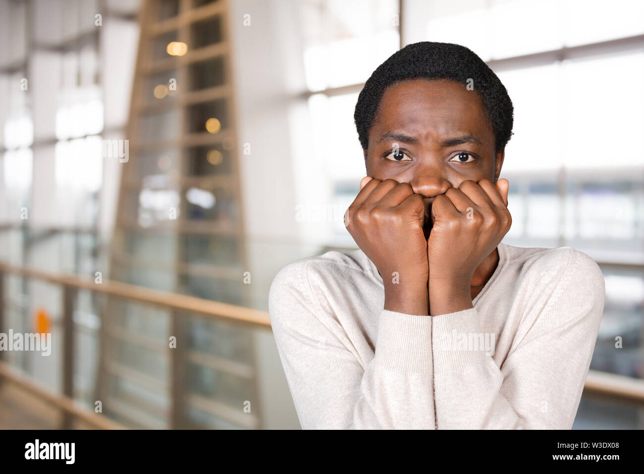 scared dark-skinned young man Stock Photo - Alamy