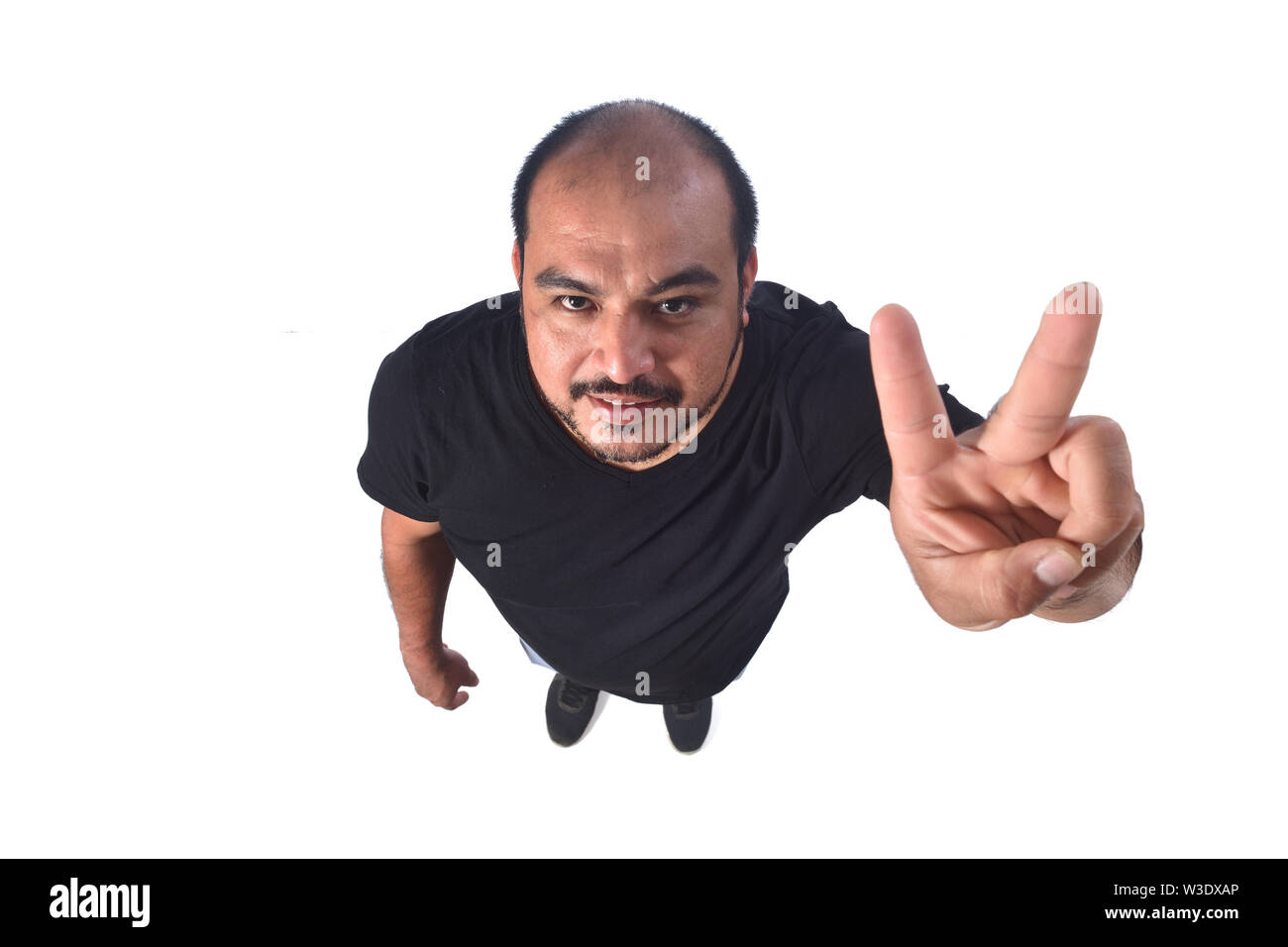 latin american man making the victory sign on a white background Stock ...