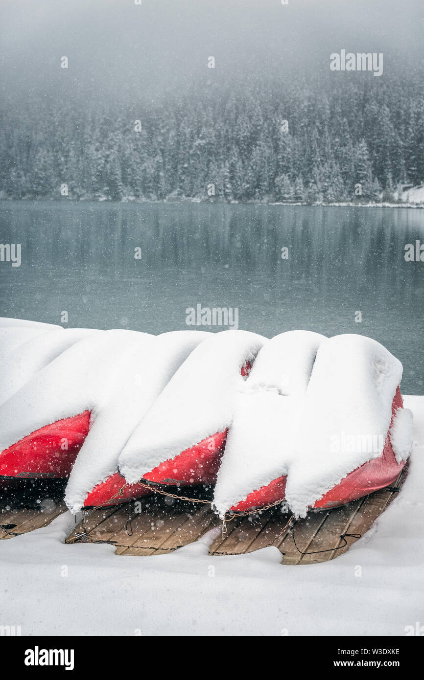 Canoe at Lake Louise under heavy snow at Banff National Park, Canada ...