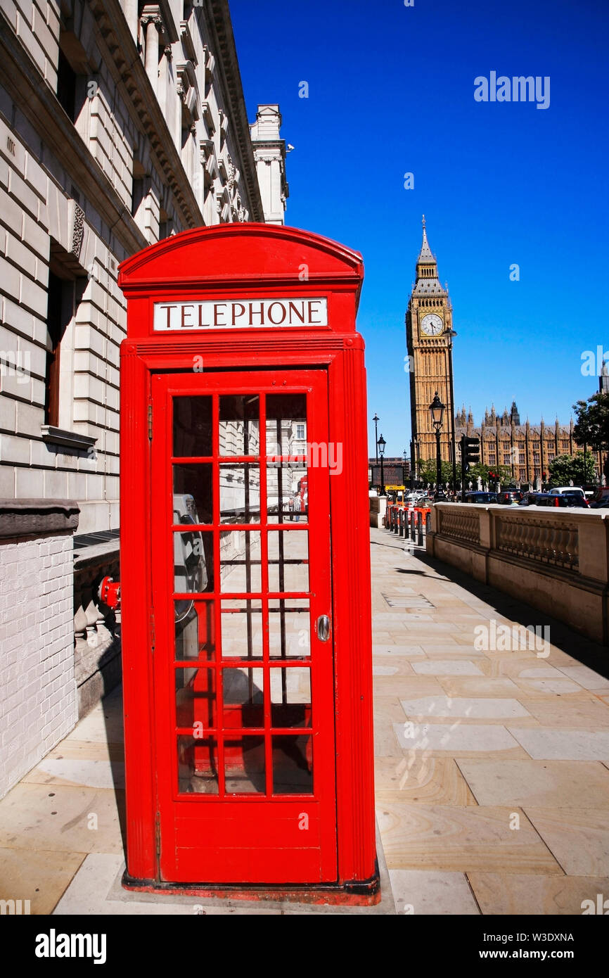 Iconic Red Telephone Booth and Big Ben Clock Tower over blue sky ...