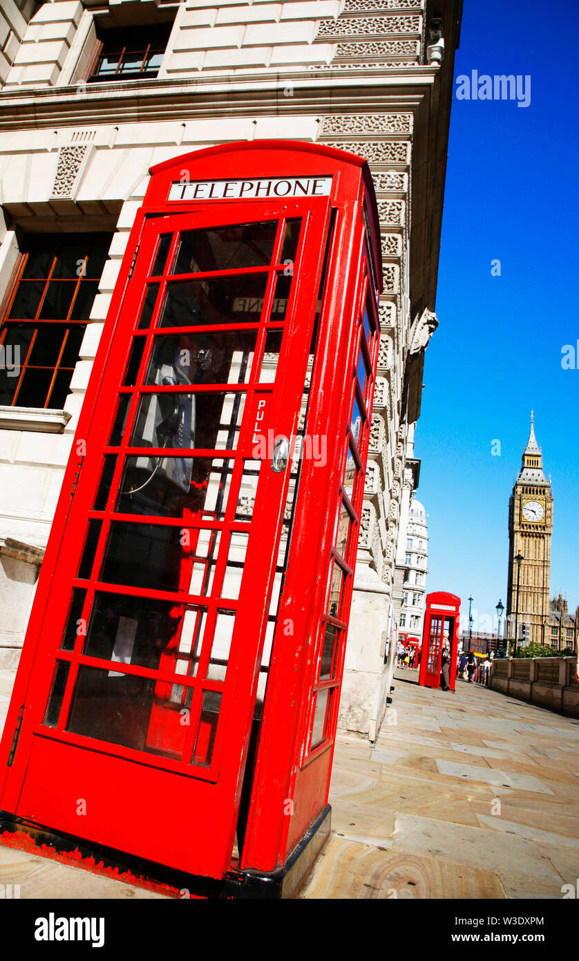 Iconic Red Telephone Booth and Big Ben Clock Tower over blue sky ...