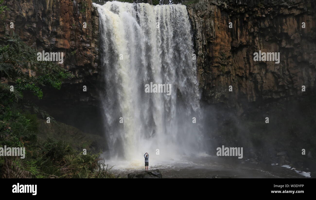 Waterfalls of Australia. A lone tourist standing before the Trentham ...