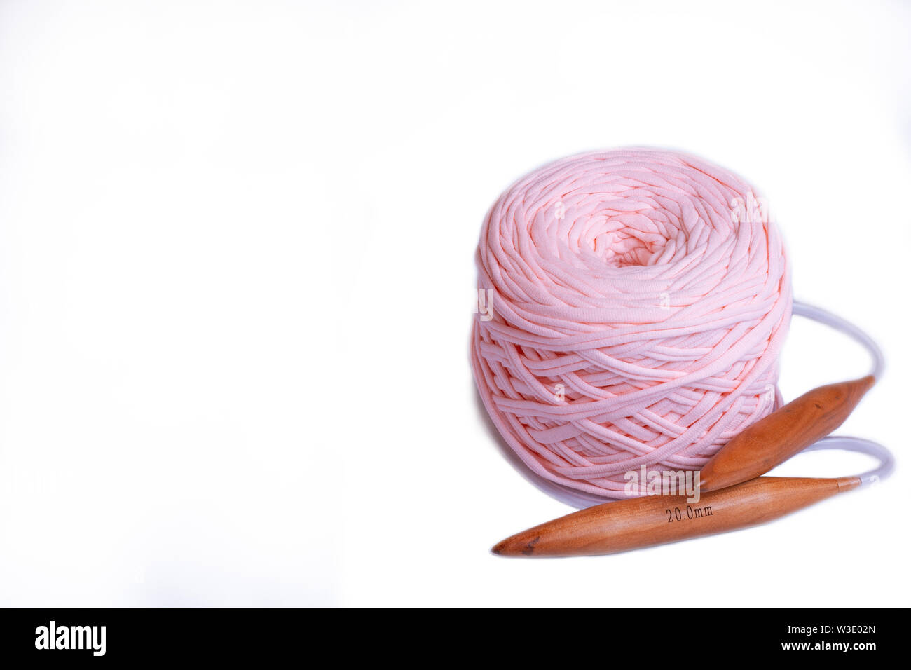 Hobbies and creative activities concept - a coil of large knitted yarn ...
