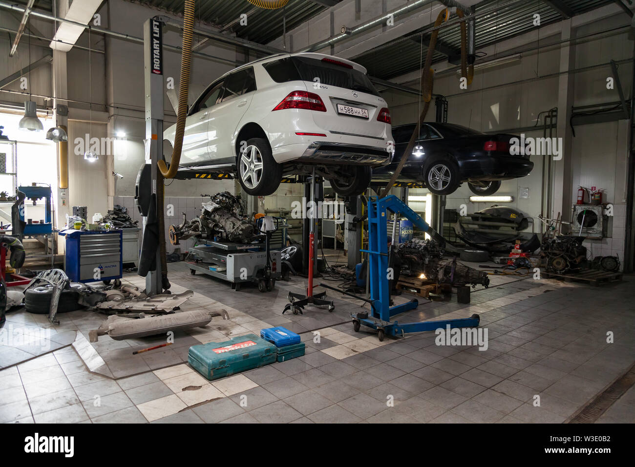 Novosibirsk, Russia - 08.01.2018: Two used cars with an open hood ...