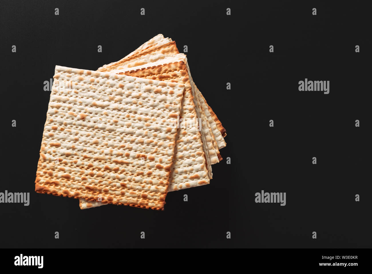 A photo of matzah or matza pieces on black background. Matzah for the ...